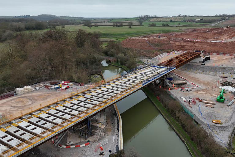 Moment HS2 engineers install steel bridge over Midlands canal