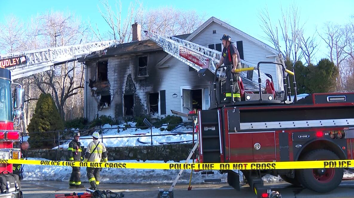 Woman dies following rescue, massive fire burns through two-story house