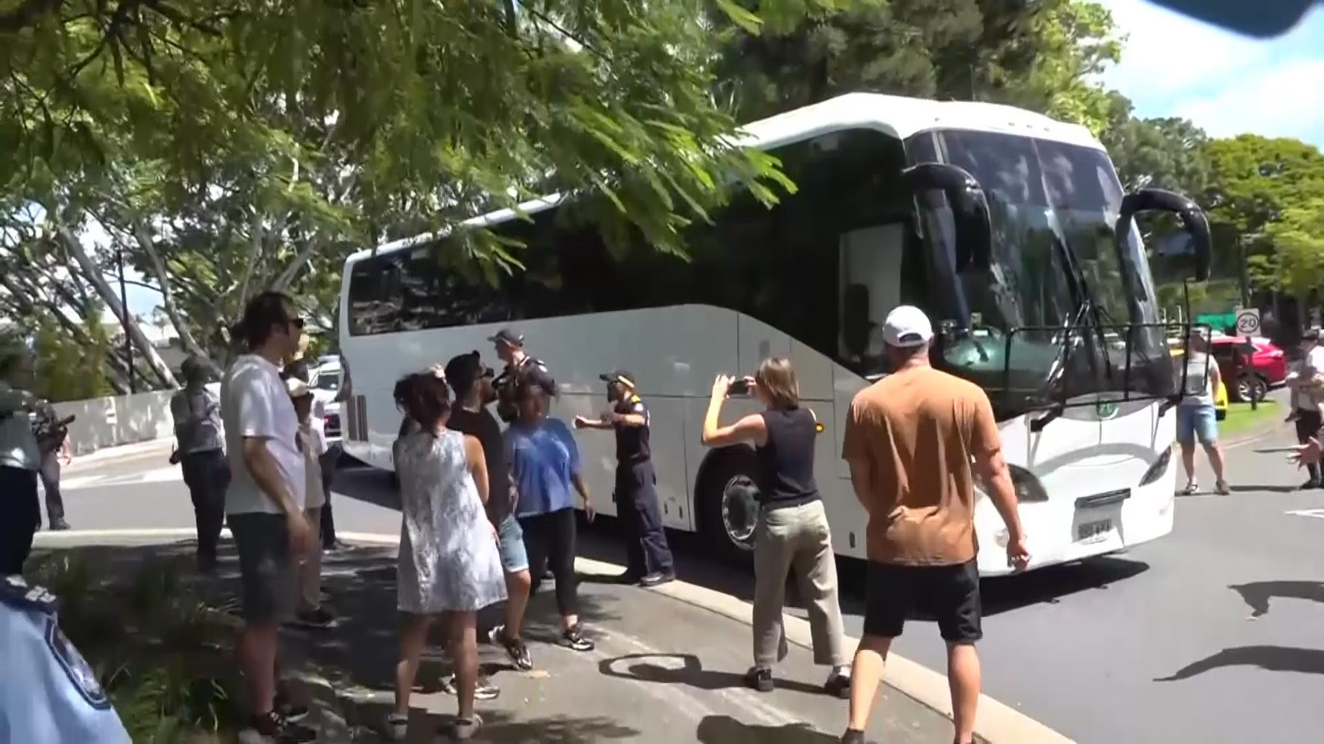 Protesters in Australia try to block bus believed to be carrying ...