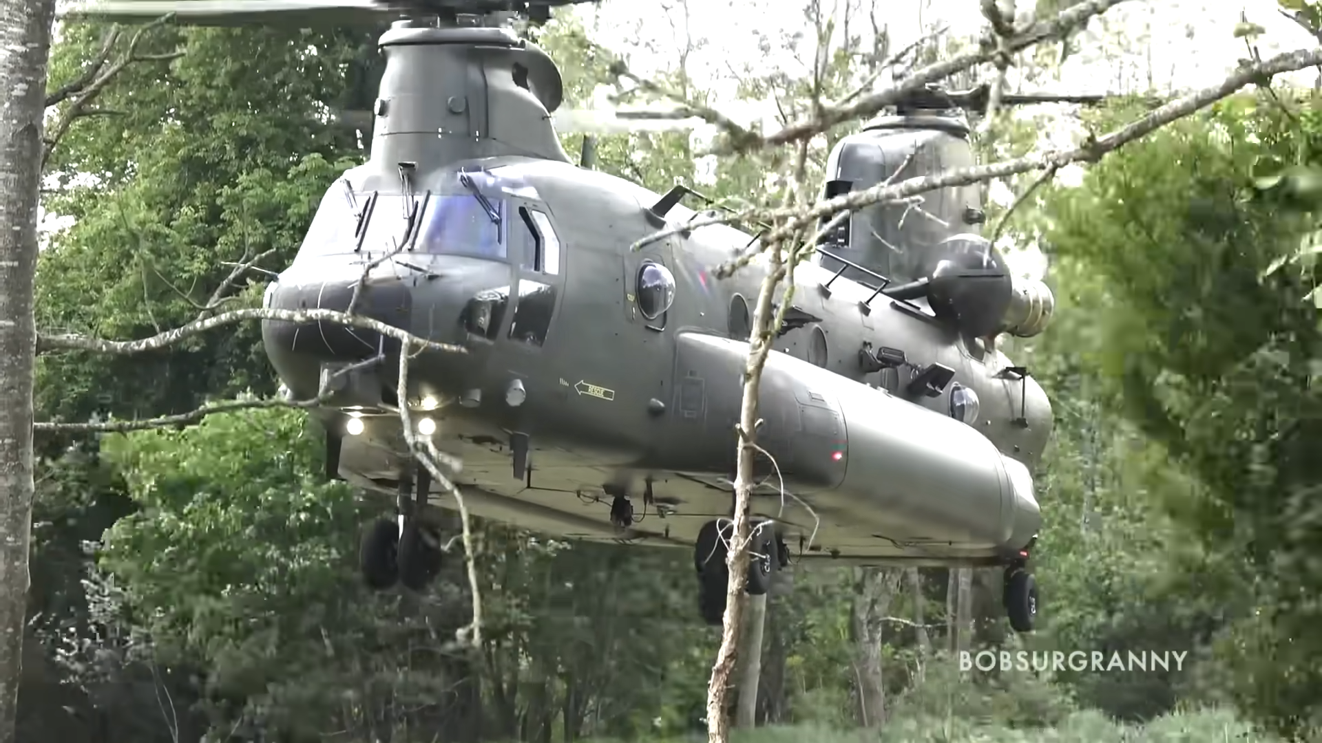Watch two heavy helicopters land where they barely fit