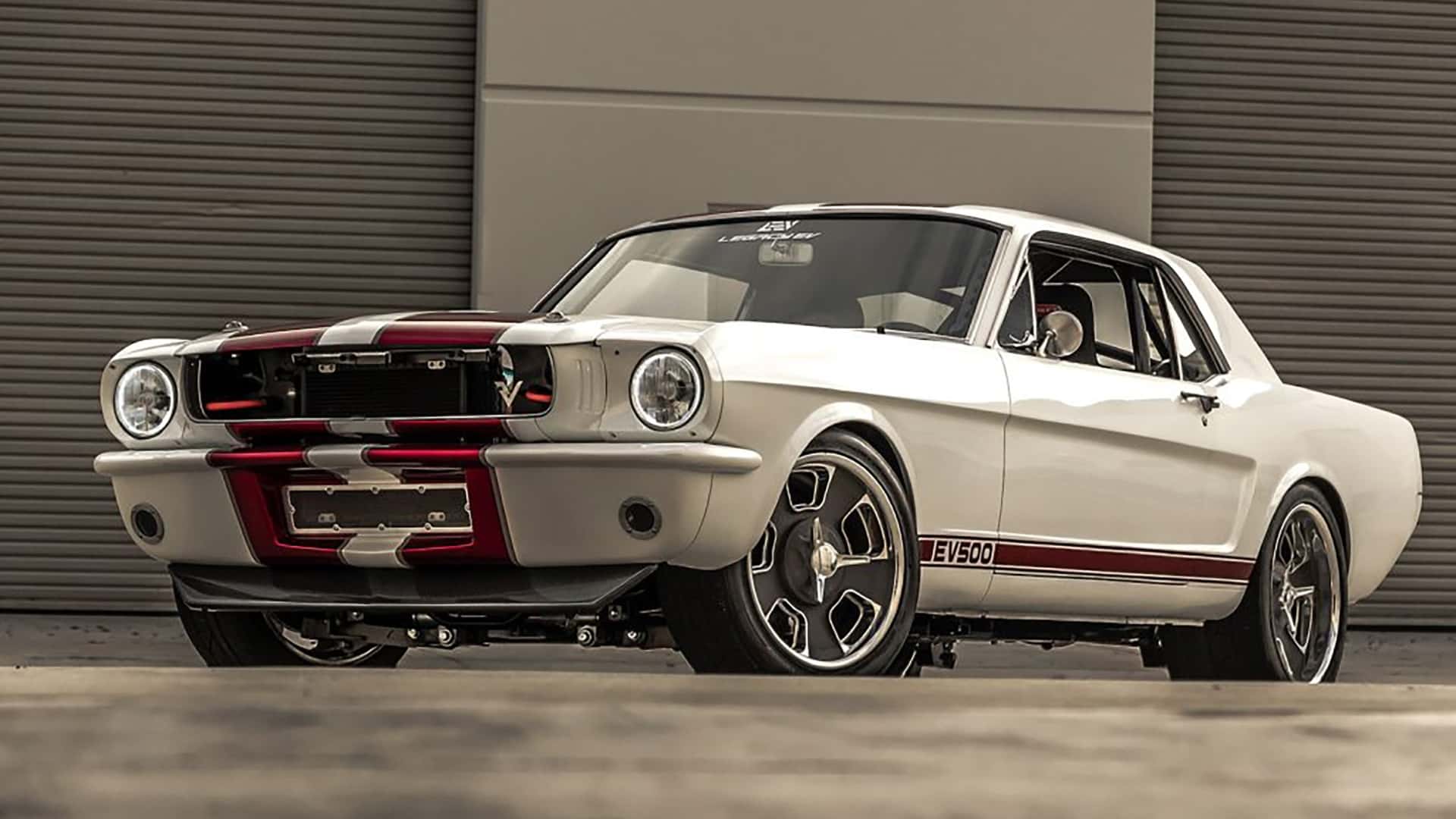 This gorgeous 1965 Ford Mustang hides a Tesla heart. The handling is wild