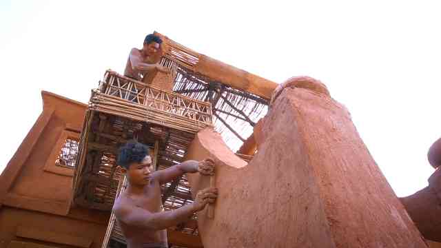 They built a modern mud house by hand, and the tile roof nearly slipped ...
