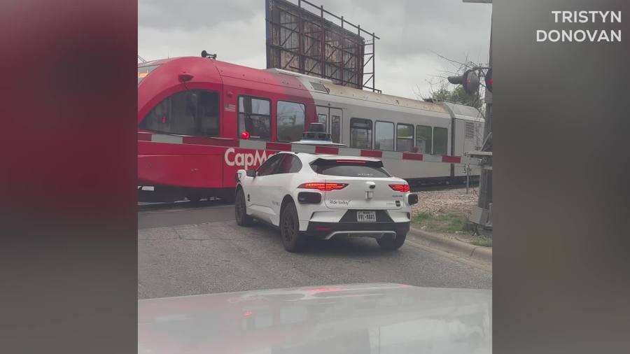 'Unique scenario': Waymo vehicle stops in between train tracks, stop arm
