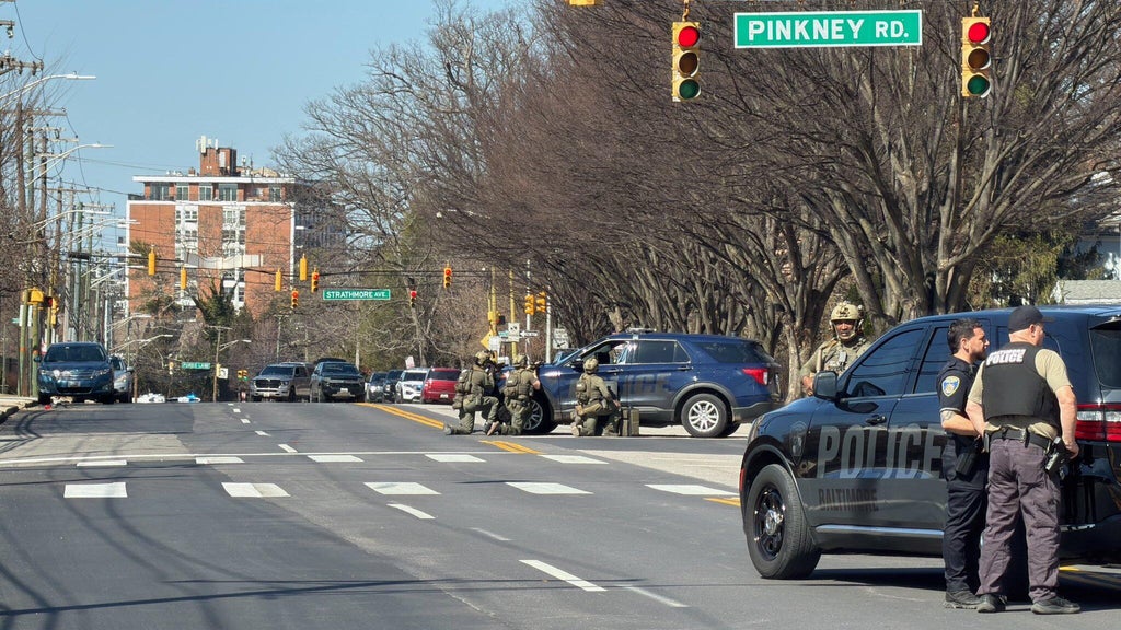 Baltimore police officer shot, suspect killed during hostage standoff ...