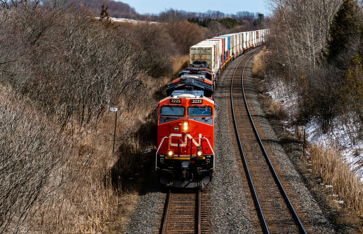 Train hits car abandoned by drunk driver at railroad crossing