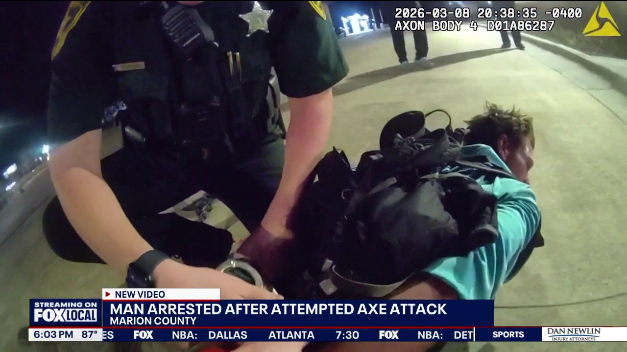 Employee subdues axe-wielding attacker at car wash