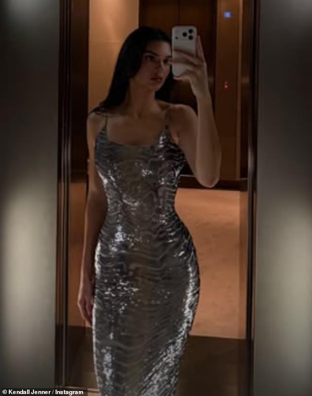 Kendall Jenner stuns in a shimmering silver dress at Milan Fashion Week ...