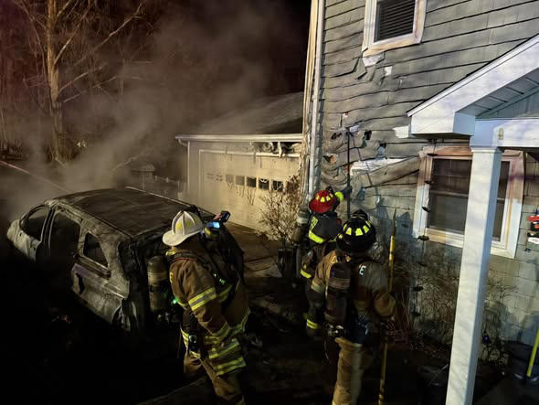 Photos: Hybrid vehicle fire causes minor damage to nearby house in New York