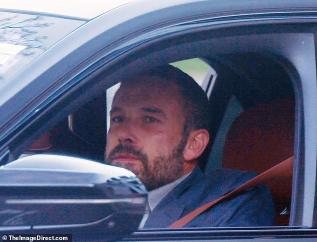 Ben Affleck pulls cigarette out of its box with his mouth while driving