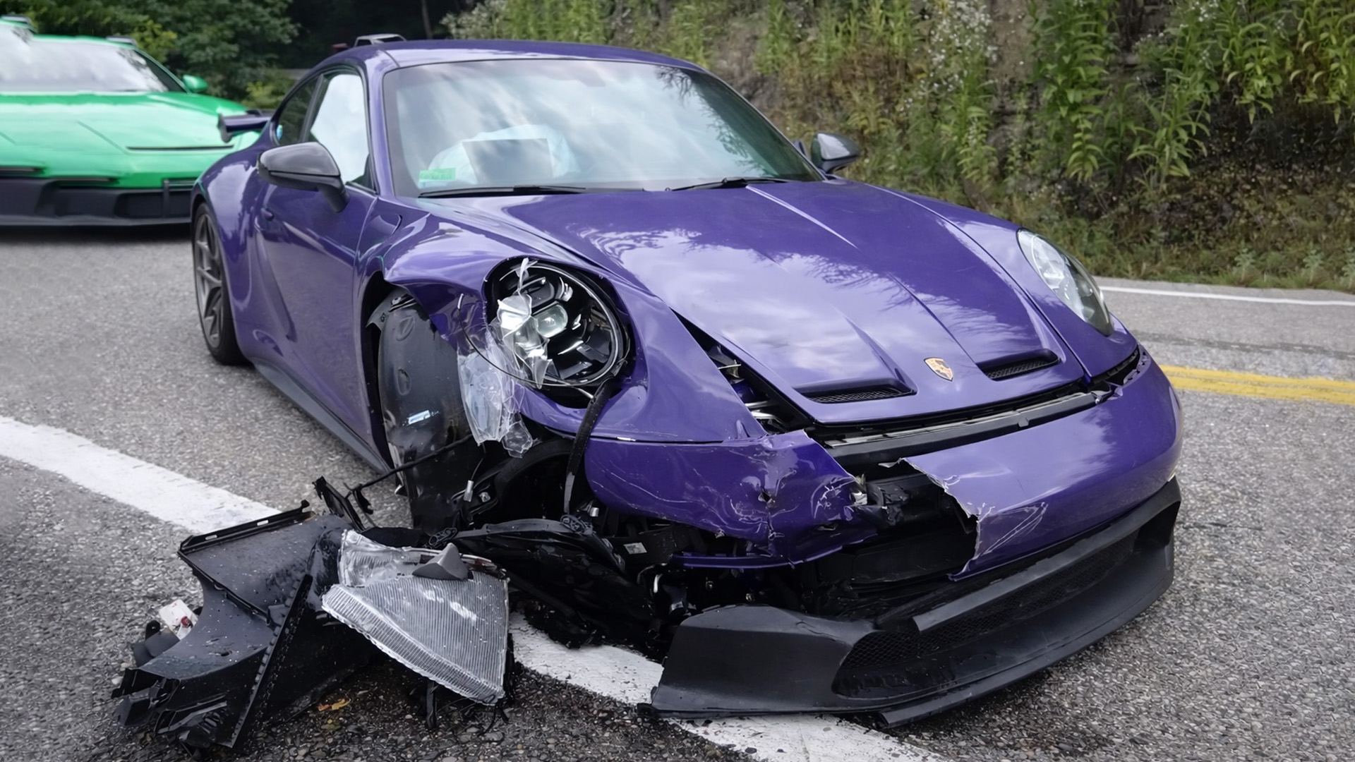 Mat Armstrong reacts to his crashed Porsche