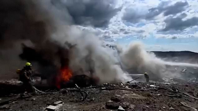 Emergency services douse flames at aftermath of deadly missile strike ...