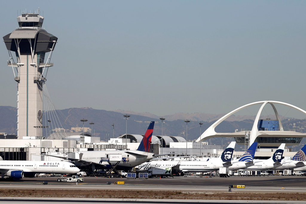 United flight returns to LA airport for an evacuation after a reported fire