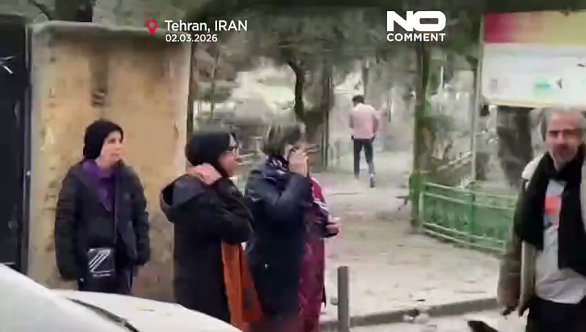 Workers clear rubble after US-Israeli strikes damage buildings in Tehran
