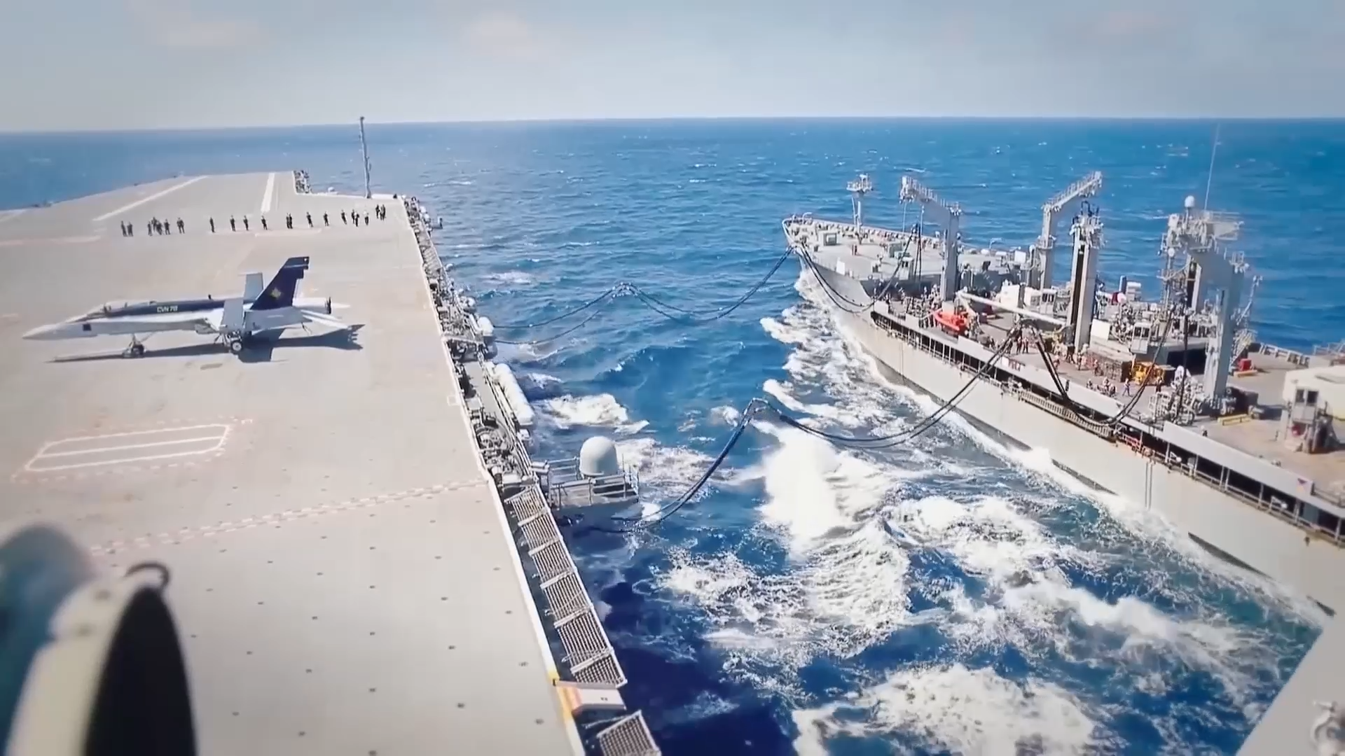 How a massive US aircraft carrier is refueled at sea while moving