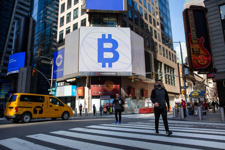 Coinbase, other crypto stocks surge. What’s behind the rally?