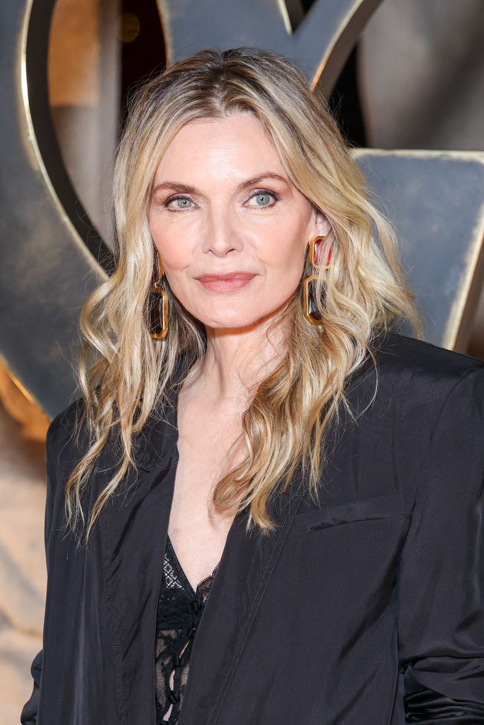 Michelle Pfeiffer stuns in plunging silky ensemble as she approaches ...