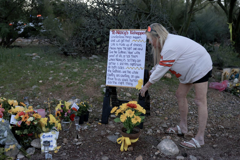 Volunteers are seen combing Nancy Guthrie’s property with metal ...
