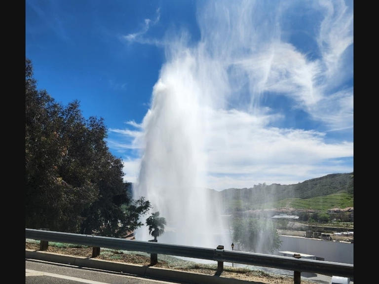 Hydrant struck, water geysers near Old Town Temecula, Santiago Bridge