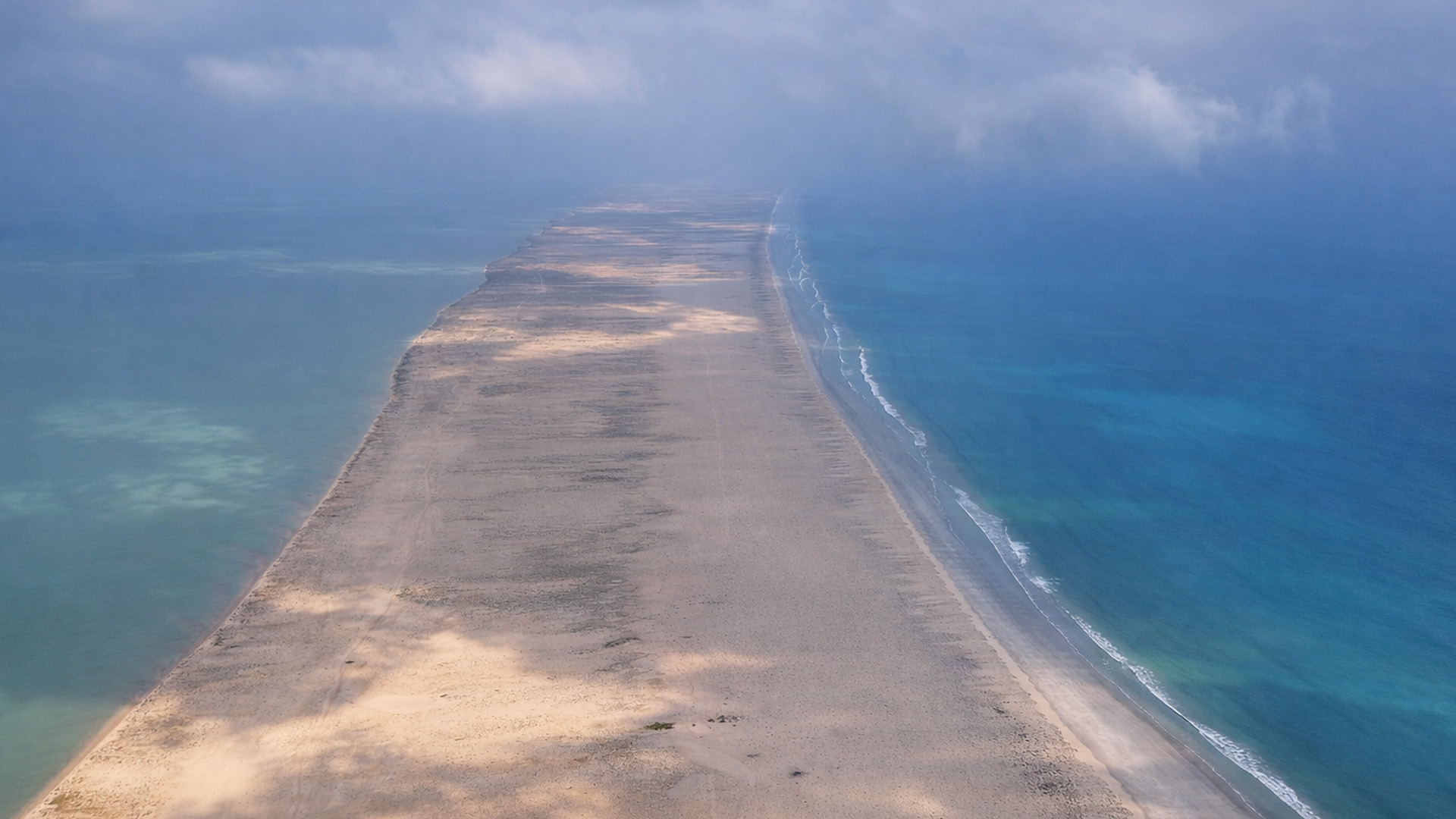 How does land form in the middle of the ocean?