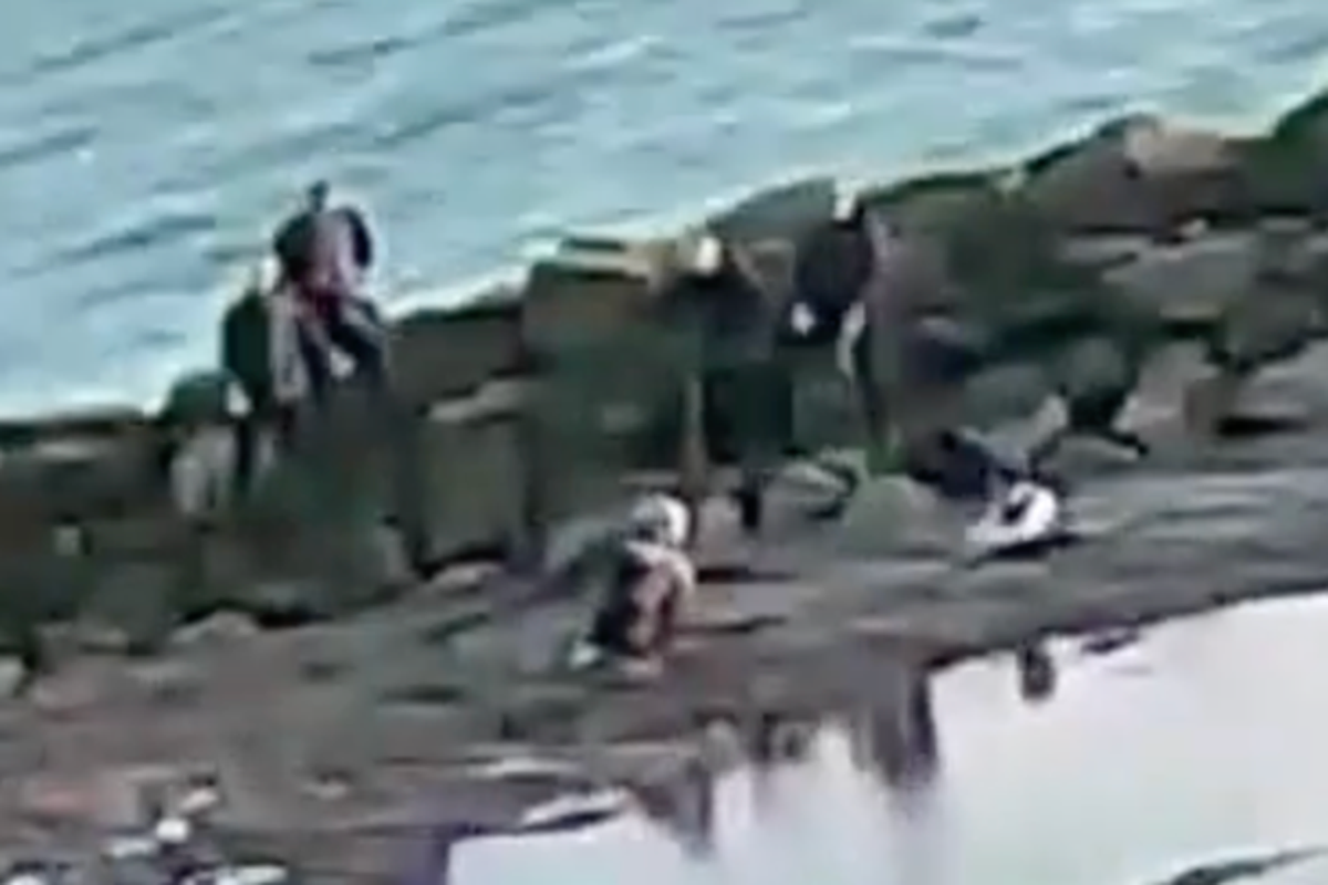 Moment mother and daughter rescued from waist-deep sinking sand