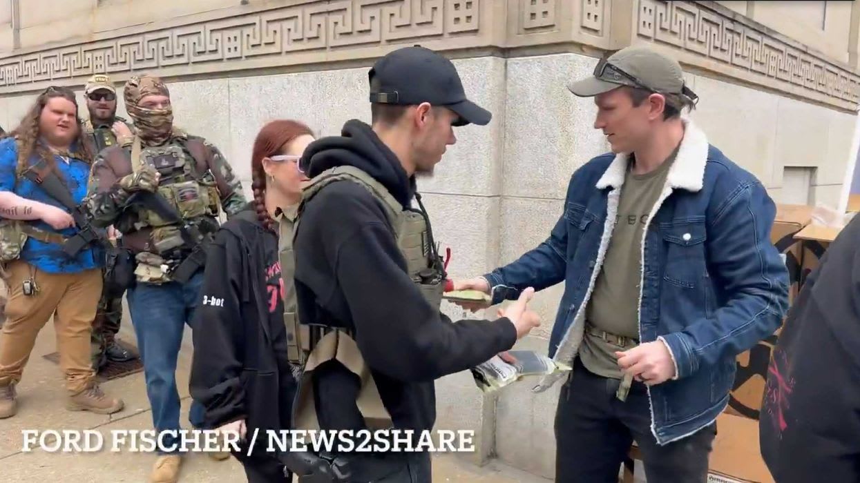 Gun activists hand out AR-15 magazines at Capitol to defy upcoming ban