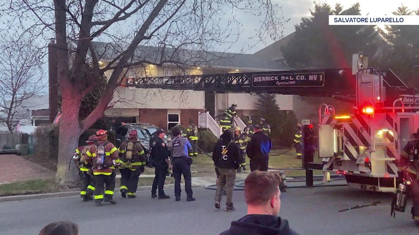 Merrick garage fire displaces 4 people