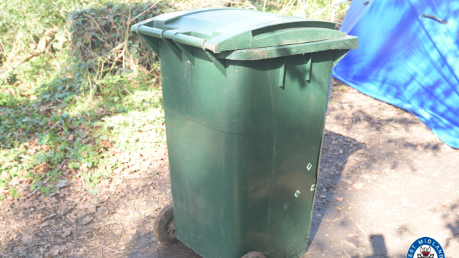 Three arrested after man's body found in wheelie bin