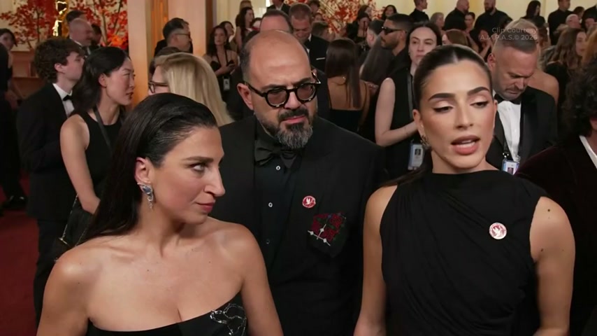 Filmmakers wear 'ceasefire in Gaza' pins at the Oscars red carpet