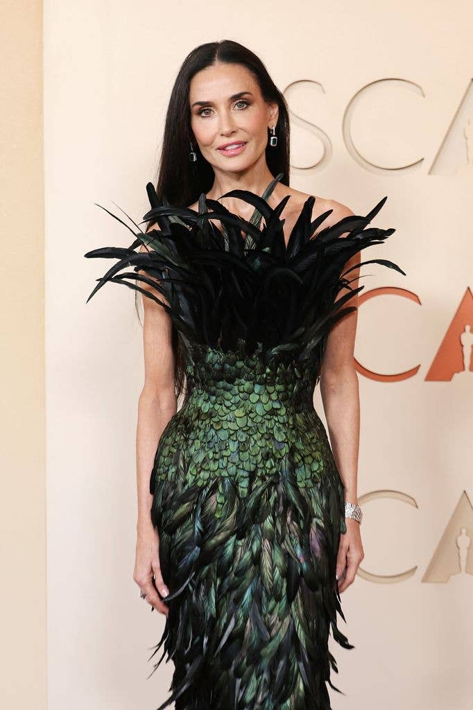 Demi Moore steals the show in a dramatic feathered Gucci gown at the ...