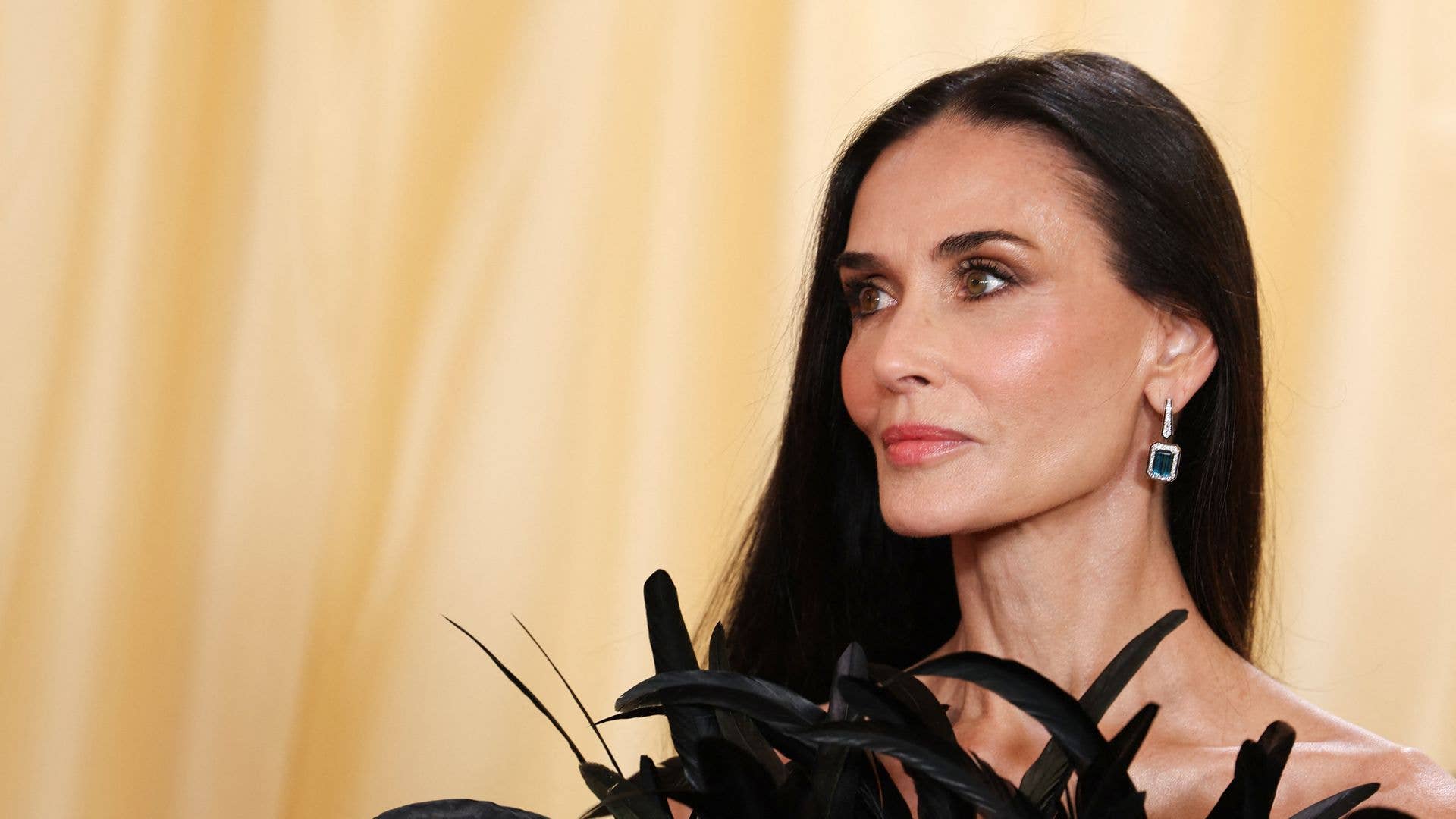 Demi Moore steals the show in a dramatic feathered Gucci gown at the ...