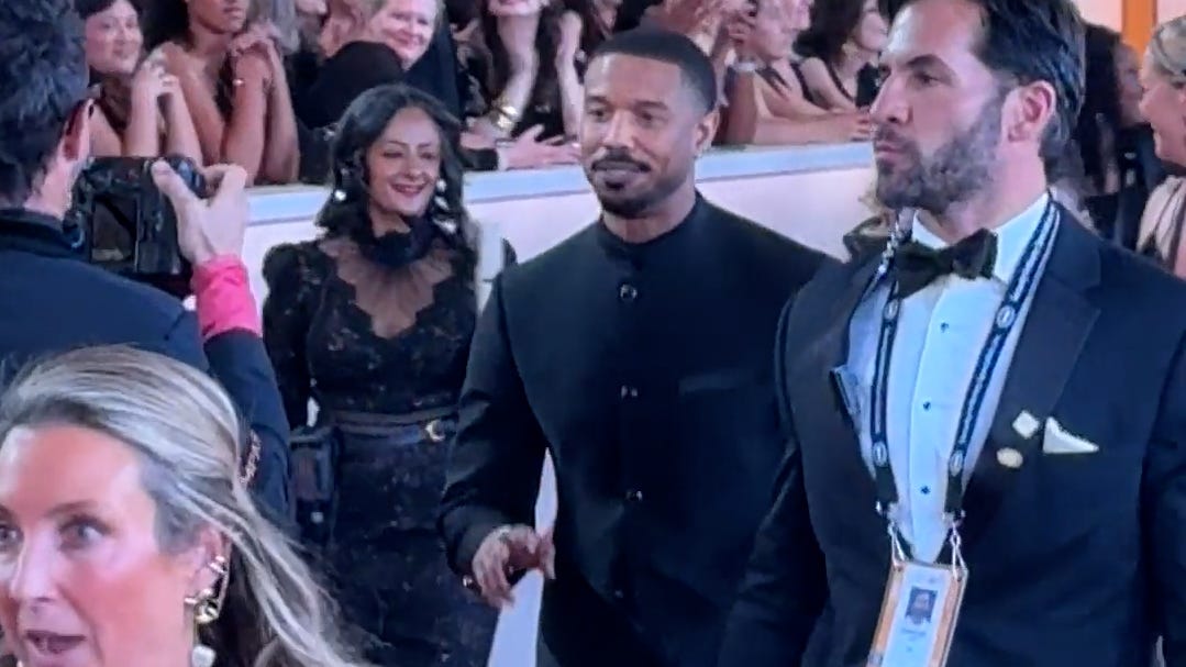 'Sinners' star Michael B Jordan greets Kevin Frazier on Oscars carpet