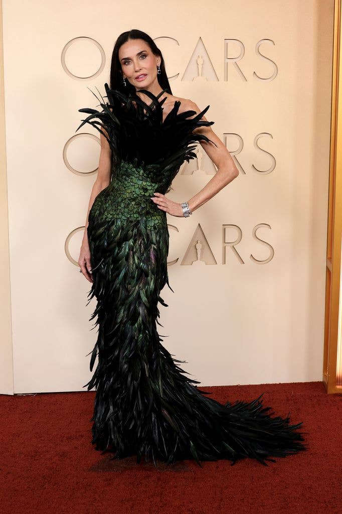 Demi Moore steals the show in a dramatic feathered Gucci gown at the ...