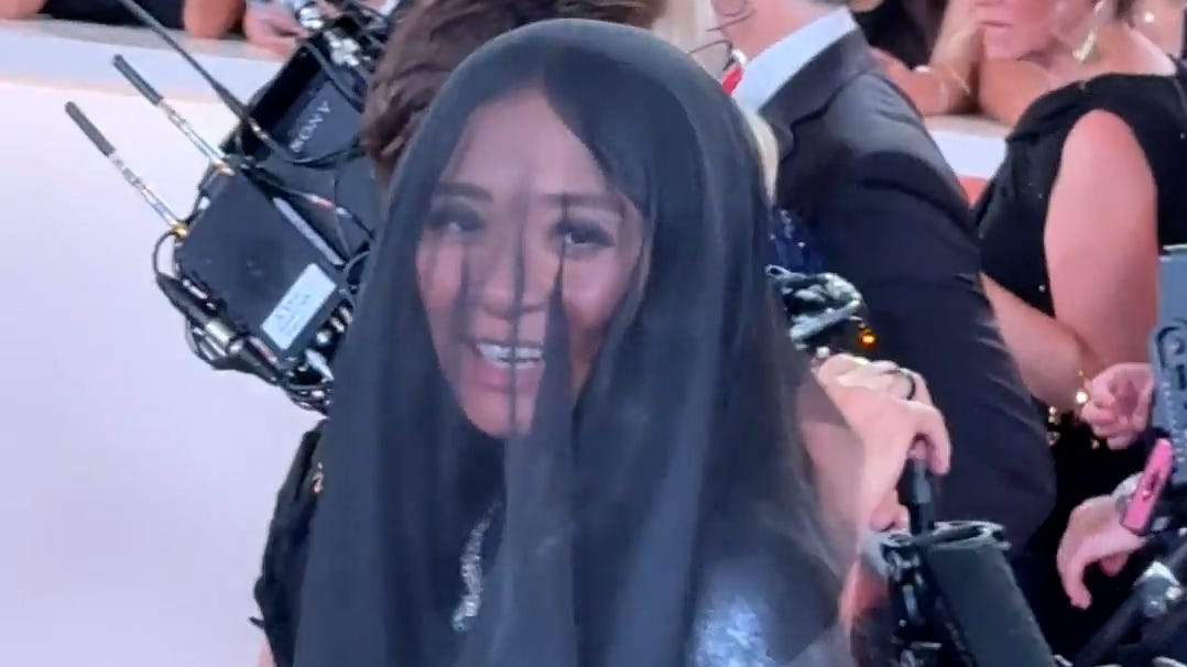 Chloé Zhao slays on the Oscars red carpet in shiny black dress, veil