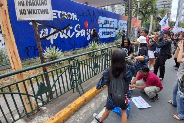 Activists pelt clay, deface gas station posters in protest vs fuel ...