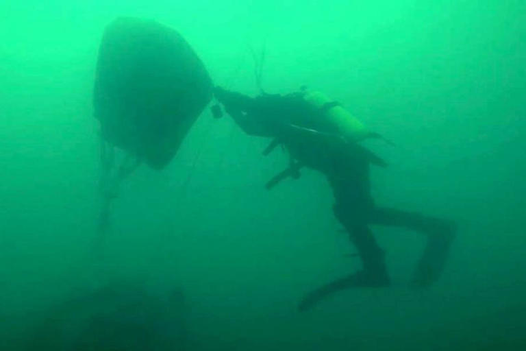 Diver finds one of USA's lost nuclear weapons and mistakes it for a UFO