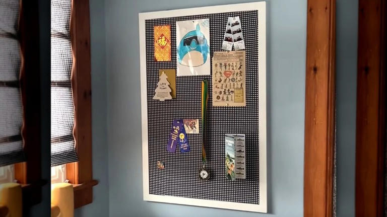 Reuse a cardboard box to make a stylish photo board for your room