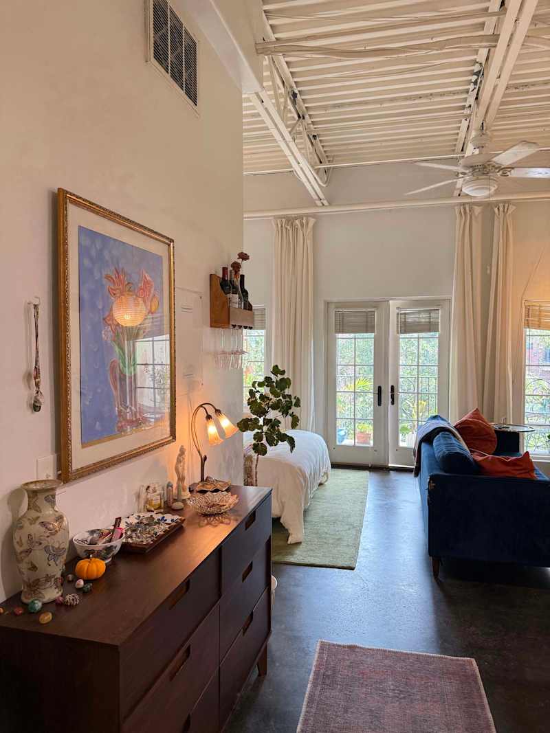 This 400-square-foot studio apartment has a massive balcony