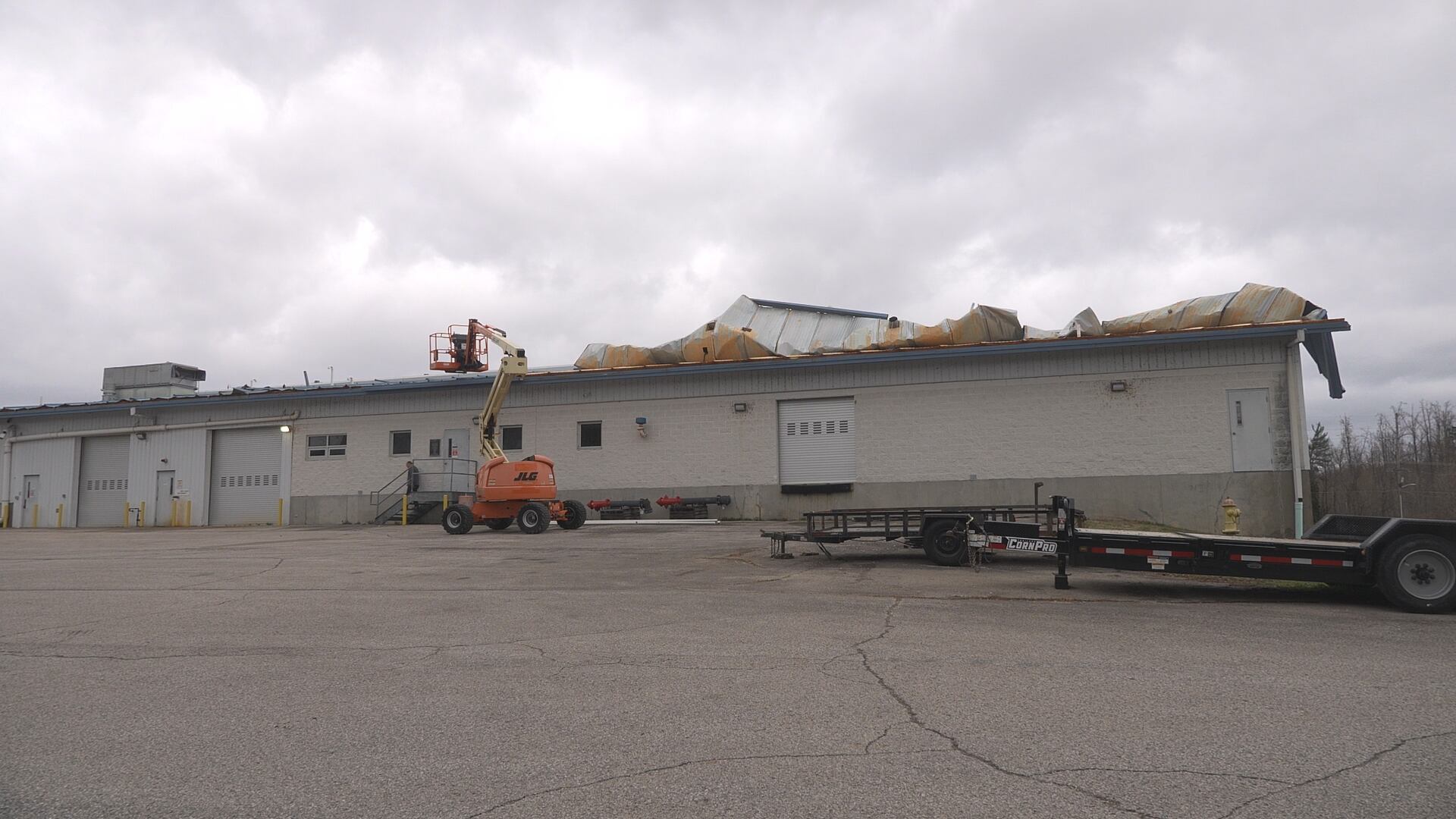 Crews work to fix roof damage to Scottsburg Water Department building