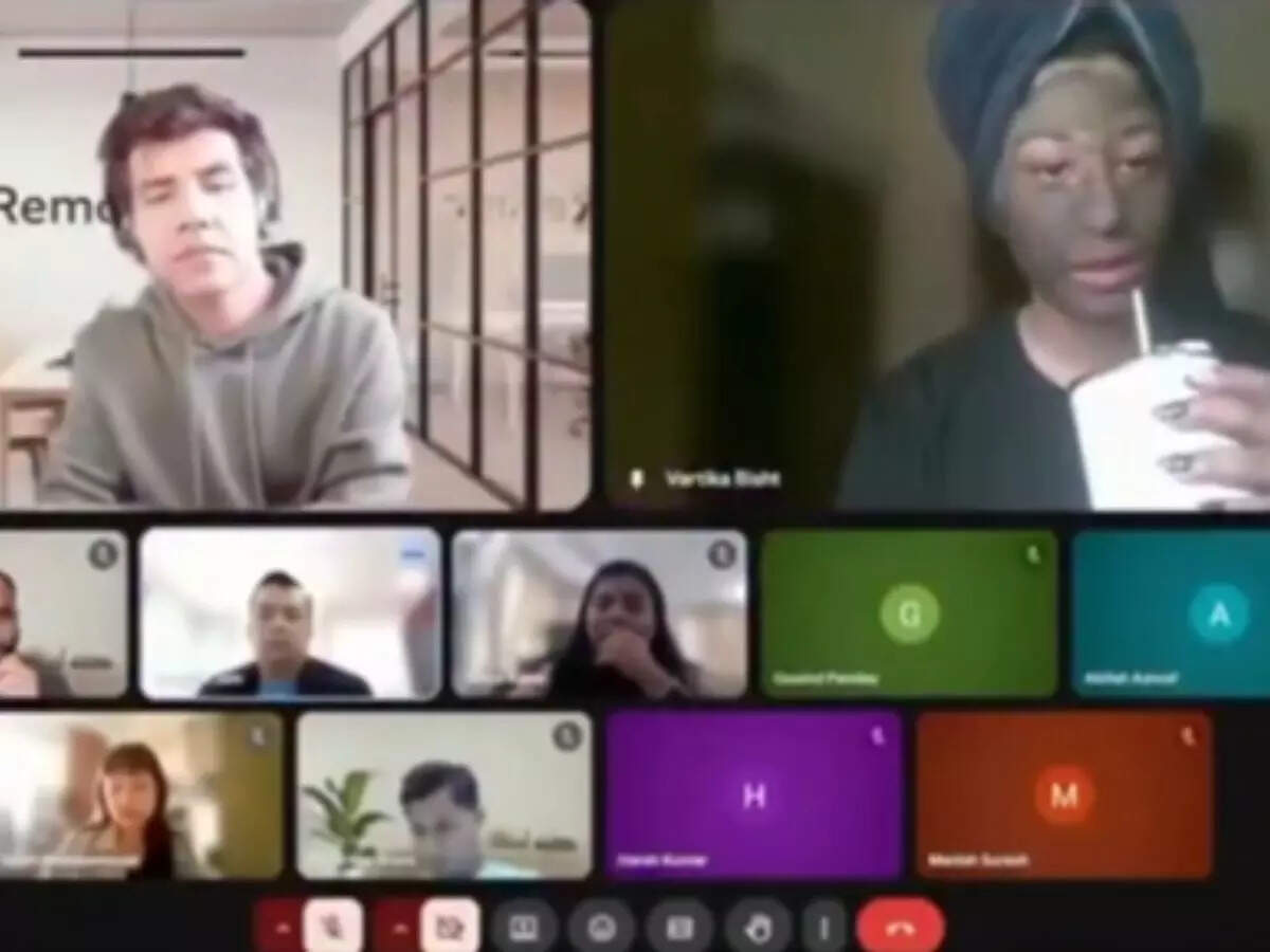 Gen Z employee attends online meeting with neem face mask, sipping ...