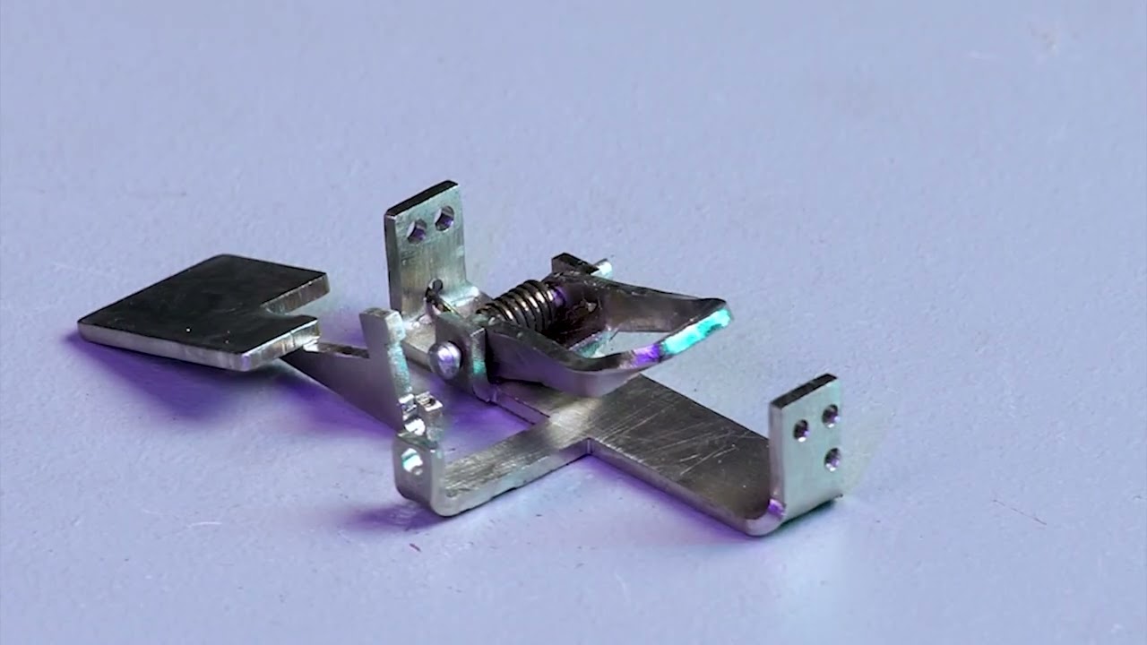Handmade metal bear trap keychain build