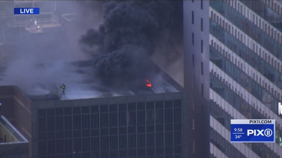 Fire sends smoke billowing from roof of Midtown building