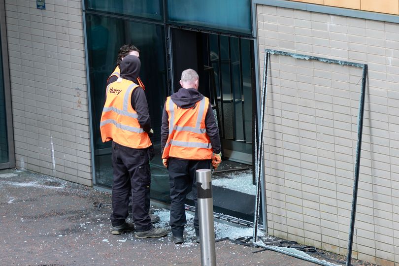 Burnt out car towed from Flannels in Livingston after ram-raid by ...