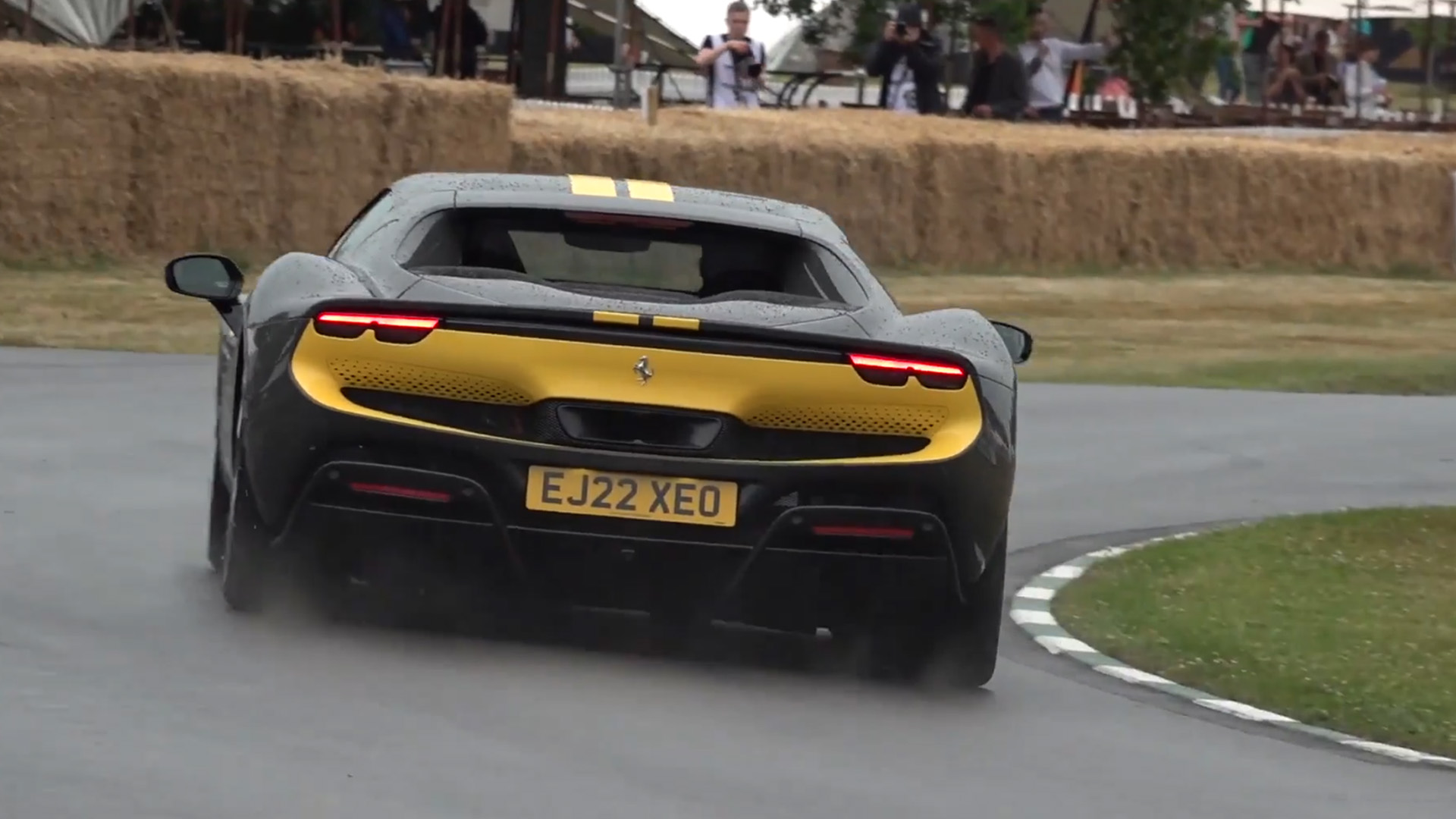 Ferrari 296 GTB slides dangerously on wet track corner