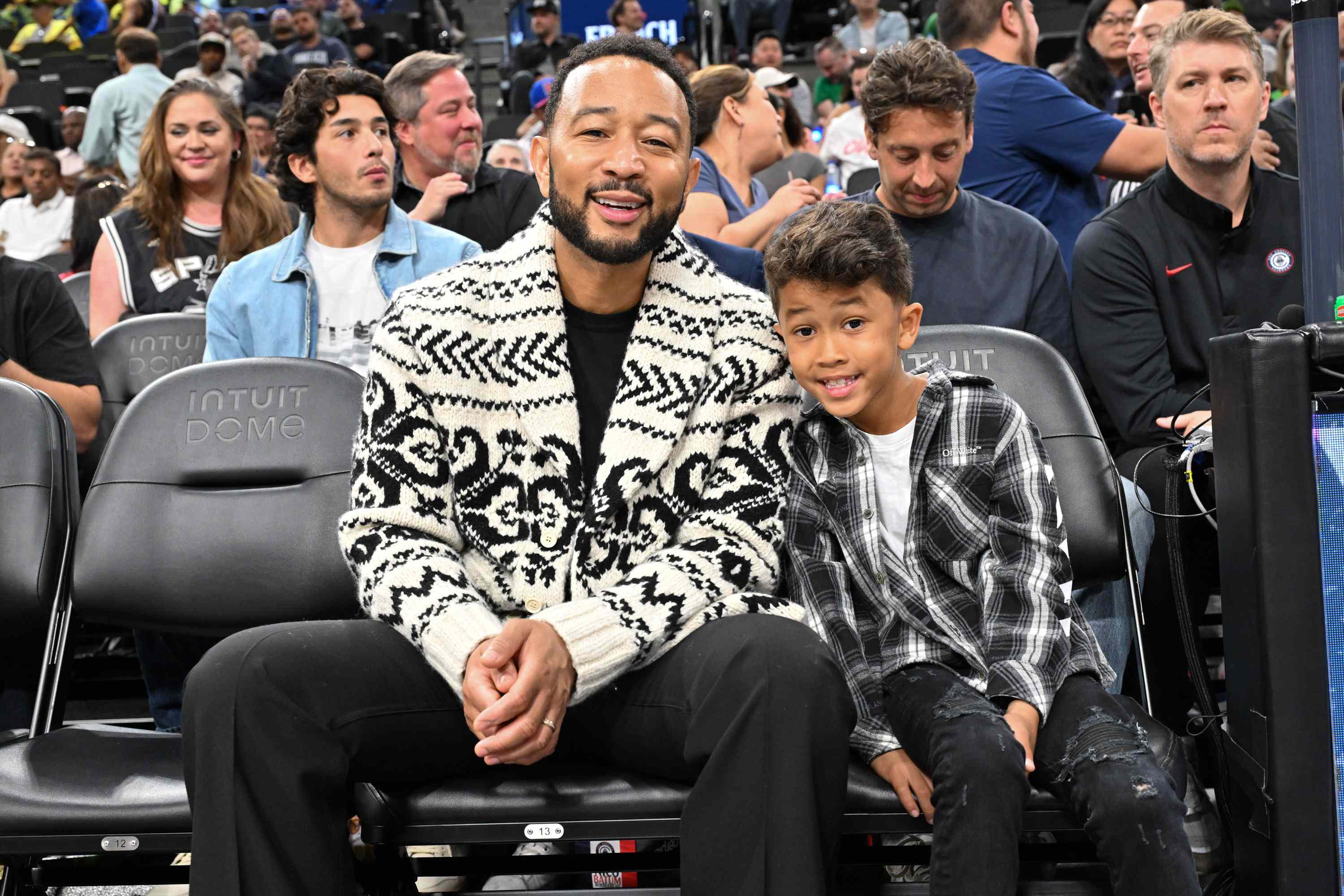John Legend's son Miles is his literal twin with long wavy hair during ...