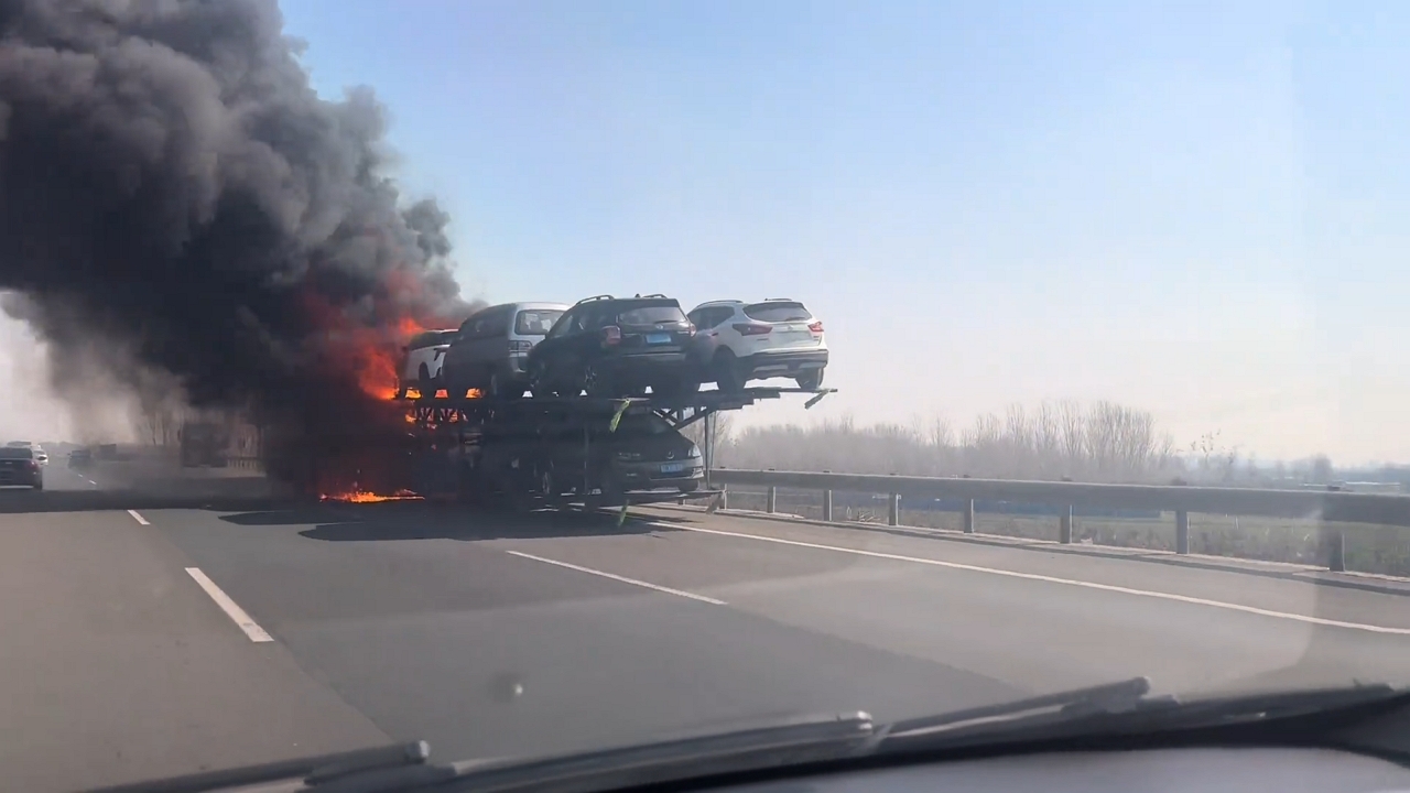 Fire engulfs cars on carrier truck along highway in Hebei, China