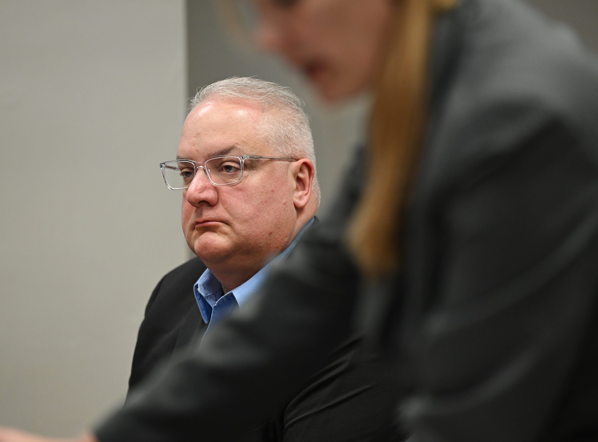 Judge to decide on trial fate for ex-House aide accused of embezzlement