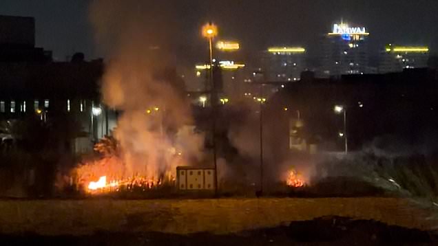US embassy compound on fire after suspected Iranian drone and rocket attack