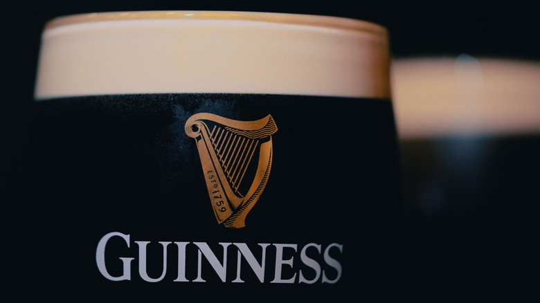 What gives Guinness beer that iconic black color?
