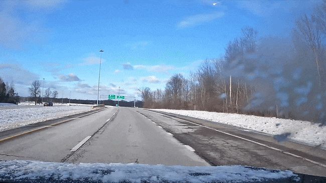 Dashcam captures daylight meteor falling over northeast Ohio highway