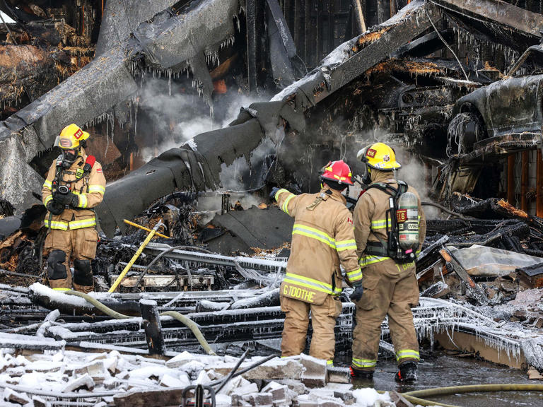 Fire tears through auto shop and luxury car dealership in southwest Calgary